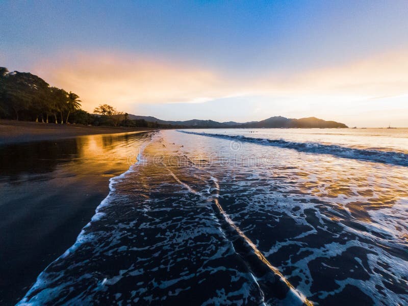 Beachscape at sunset stock image. Image of tracks, outcrop - 11339089