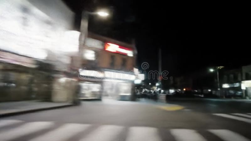 Exploring a Quiet Town at Night with Glowing Storefronts and Empty ...