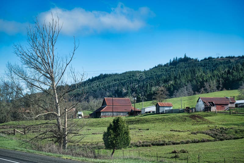 Serene Farm with Silos and Mountains Stock Photo - Image of barn, farm ...