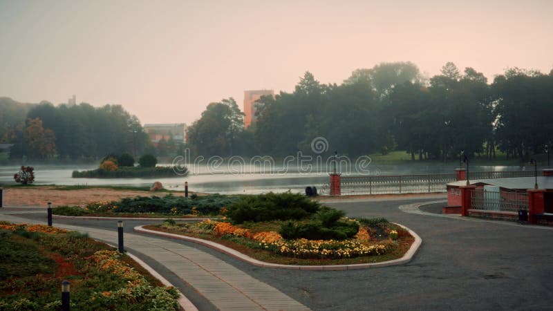 Tranquil Lakeside Pathway on a Misty Morning Stock Video - Video of ...