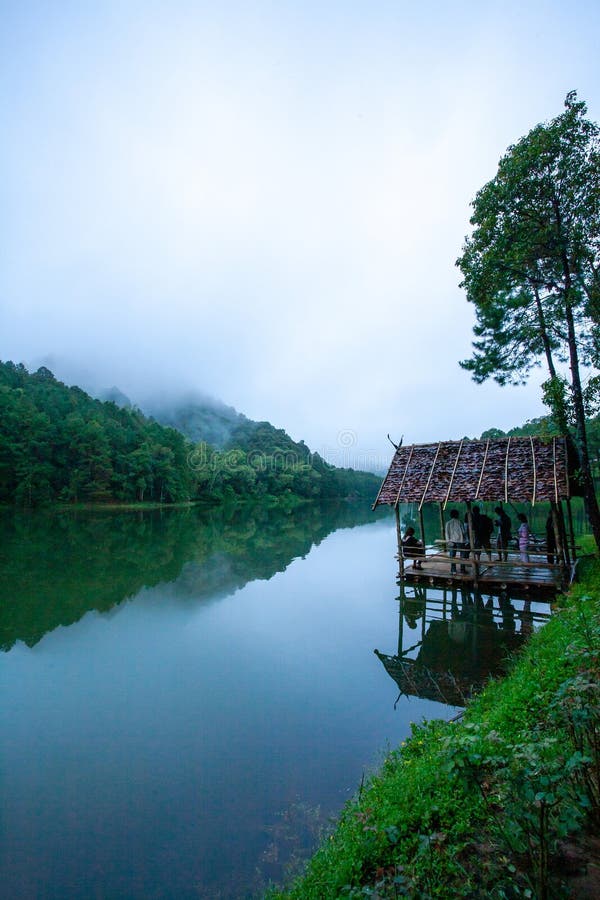 Serene Lakeside View with Rustic Hut Stock Image - Image of forest ...