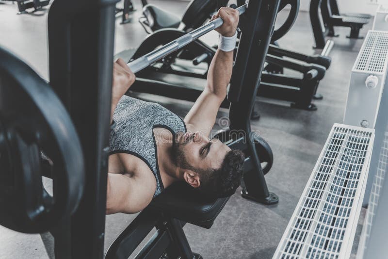 Serene Man Taking Exercise in Modern Gym Stock Image - Image of heavy ...