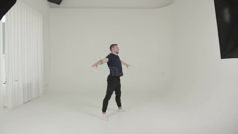 Dynamic Dance Movement Captured in a Minimalist Studio Setting with ...
