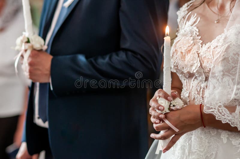 A Serene Moment of Unity Illuminated by Candlelight in a Wedding ...