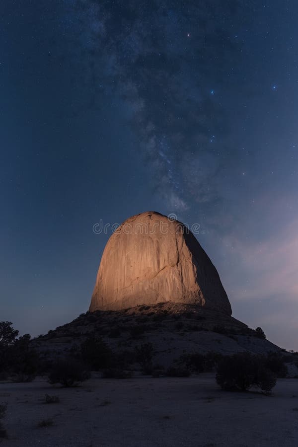 Serene Night Landscape with Large Rock Formation in Foreground. Stock ...