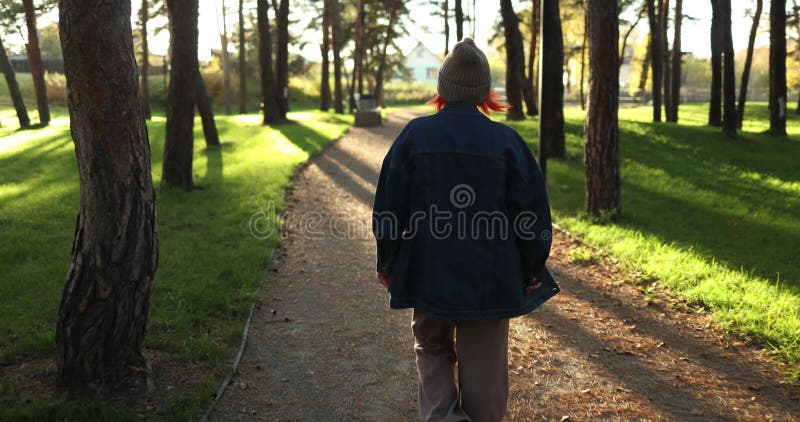 A Person is Joyfully Walking through a Peaceful Park that is Surrounded ...