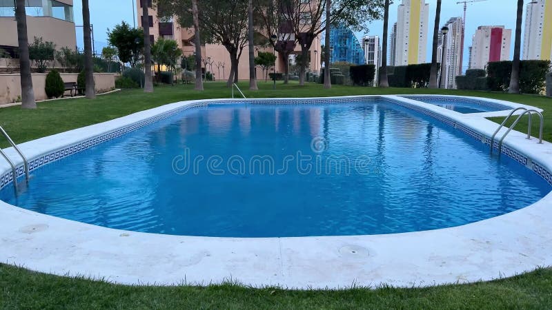 A Serene and Peaceful Poolside Scene Nestled within Modern and Elegant ...