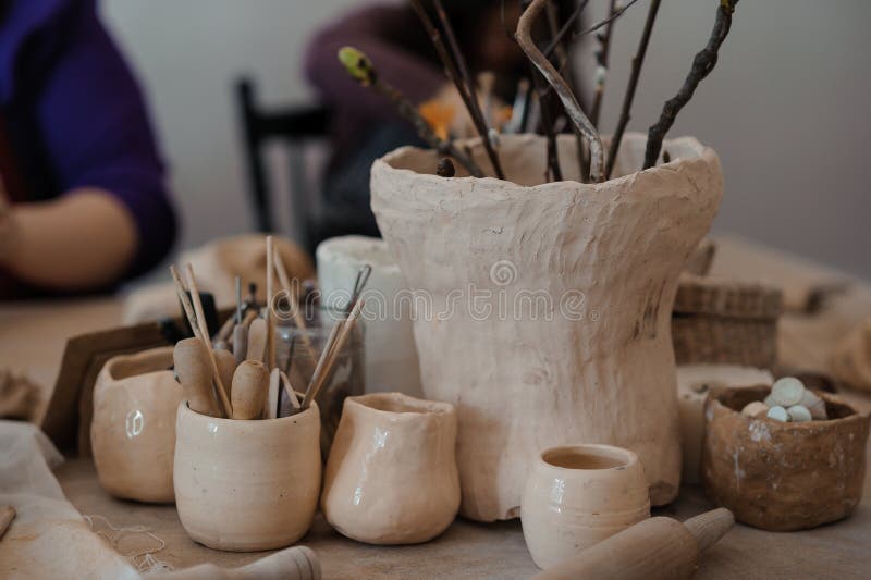 Serene Pottery Workshop with Rustic Clay Vessels and Natural Elements ...