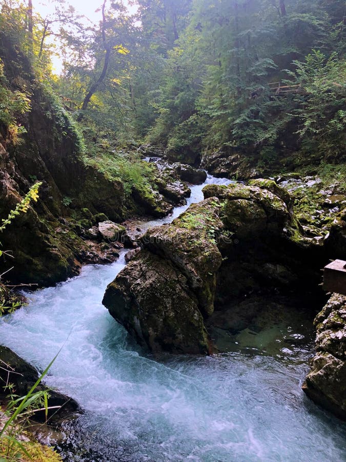 Vintgar River Flowing Under Ancient Rock Arch Surrounded by Lush Forest ...