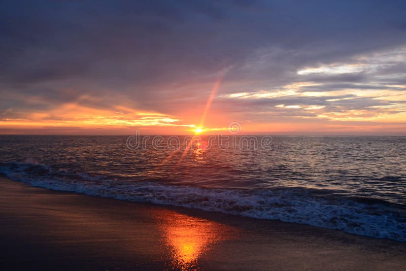 Serene Sunrise Over Ocean stock photo. Image of horizon - 77000992