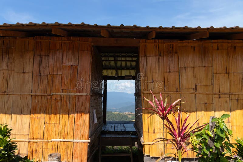 A Serene View from a Bamboo Hut Showcasing Lush Greenery and Mountains ...