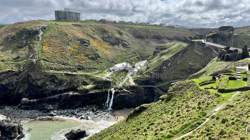 Serene View of a Beach with Clear Blue Ocean Water and Rocky Shoreline ...