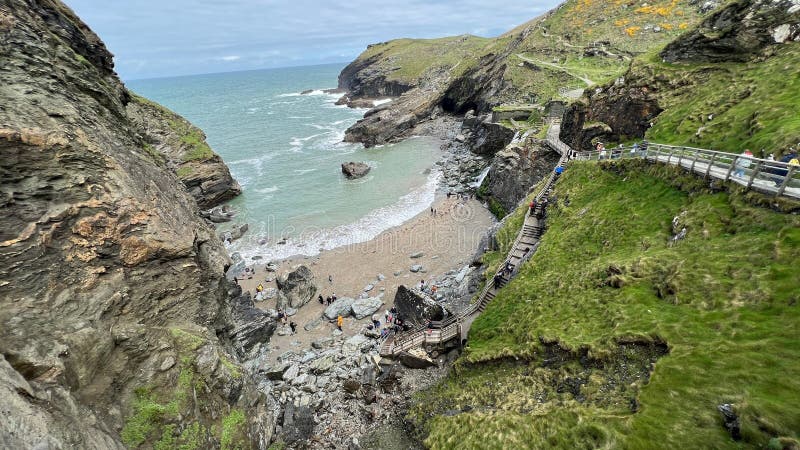 Serene View of a Beach with Clear Blue Ocean Water and Rocky Shoreline ...