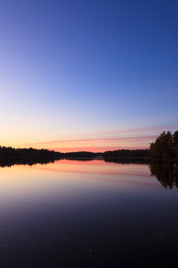 Serene View of Calm Lake and Sunset Clouds Stock Image - Image of ...