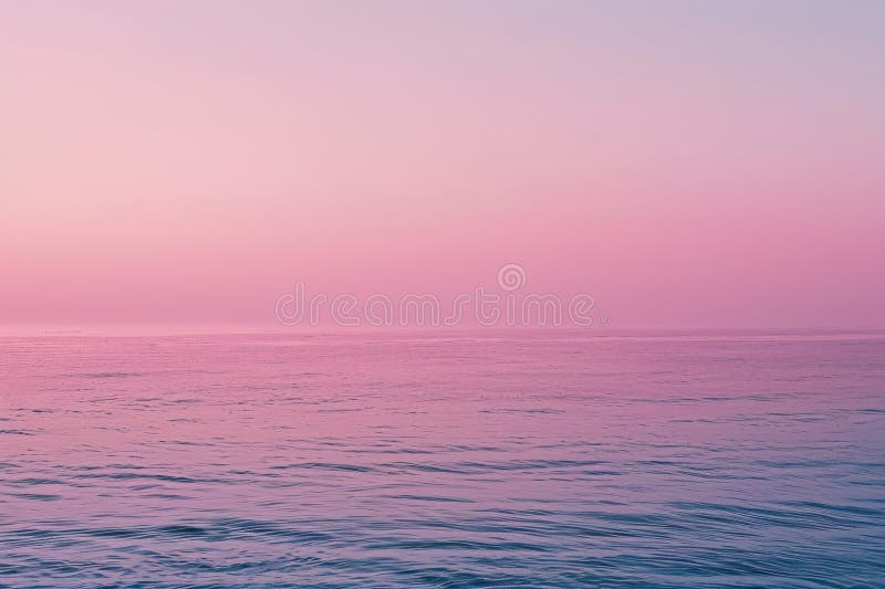 A Serene View of a Calm Ocean at Sunset, with a Soft Pink Gradient in ...