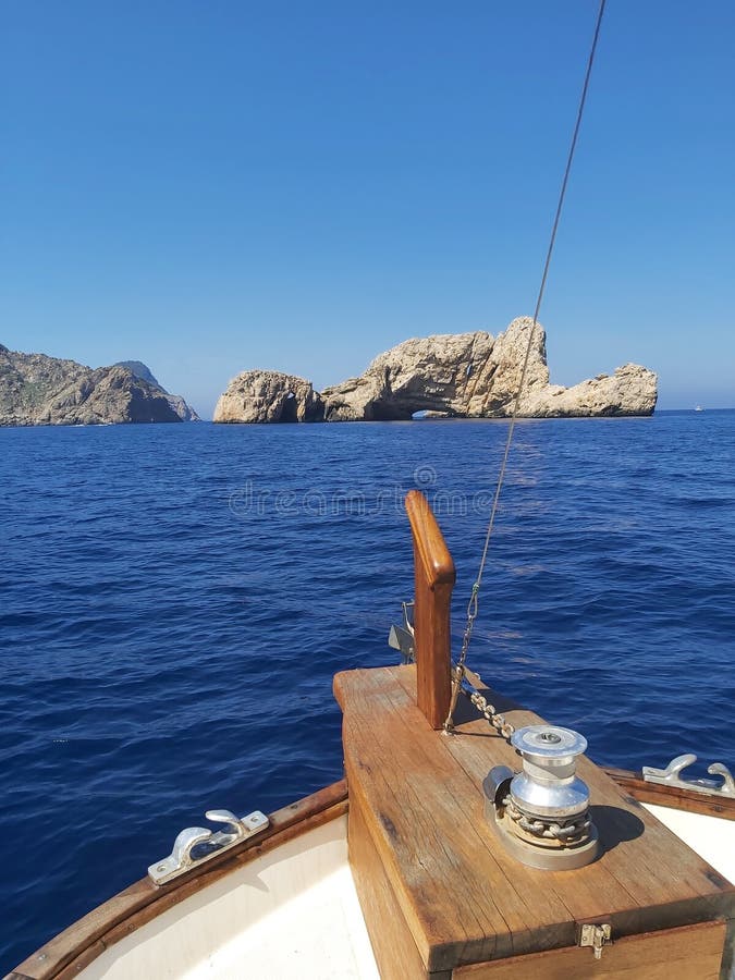 Serene View of a Cliff by the Ocean Seen from a Ship in Daylight Stock ...