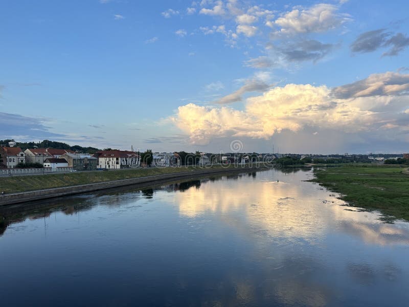 View of the River Neman with Reflection of Clouds and Buildings of the ...