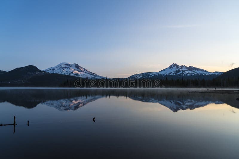 Serene View of Mountain Reflected in Lake Stock Image - Image of snow ...