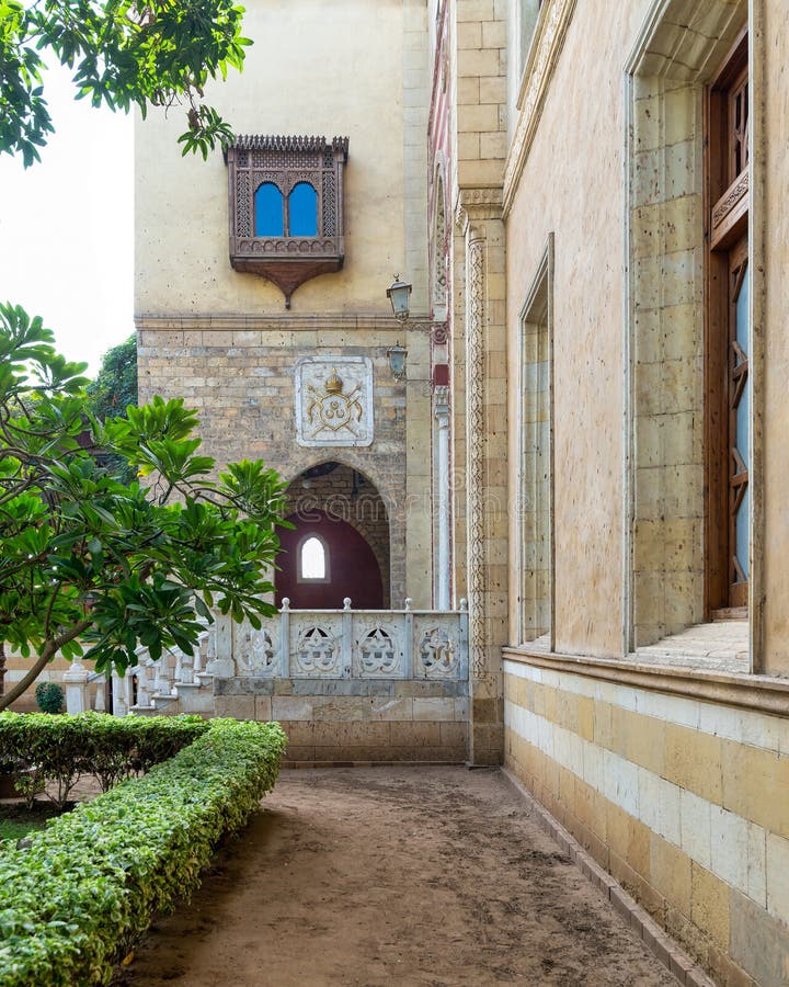 Serene View of a Rustic Style Building Featuring an Arched Balcony, and ...