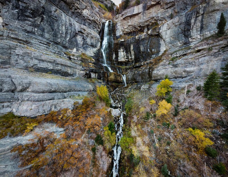Serene Waterfall Cascading into a Lush Forested Hillside Stock Image ...