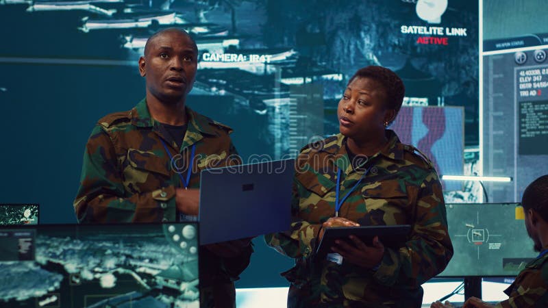 Sergeant Major and Female Soldier Checking Real Time Field Data in ...