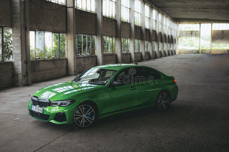 3 Series German Green Bmw from the Front Side at an Angle Inside a Long ...