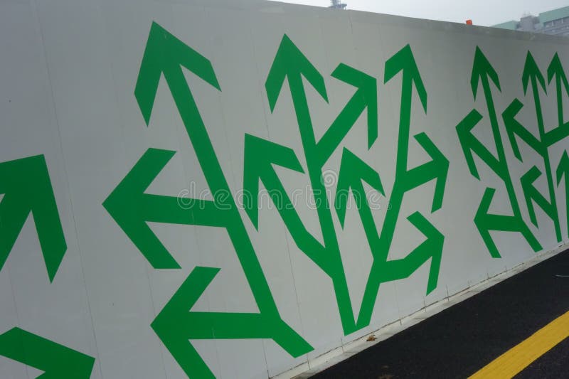 A Series of Green Arrows Illustrated on the Fence at the Construction ... A Series of Green Arrows Illustrated on the Fence at the Construction ...