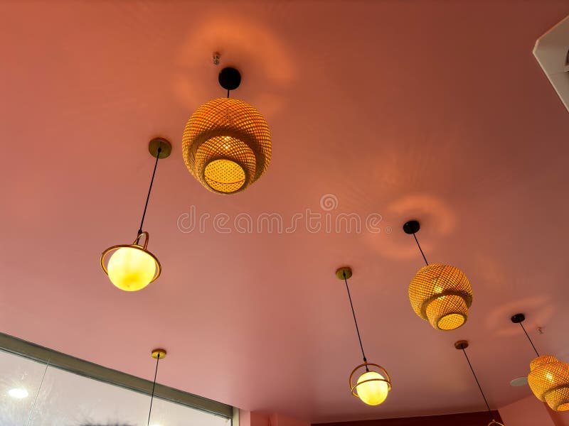 A Series of Hanging Lights with a Yellow Glow Stock Photo - Image of ...