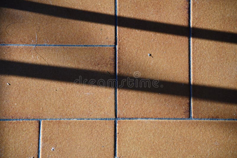 Shadow on Brown Ceramic Tiles Stock Photo - Image of light, putzen ...