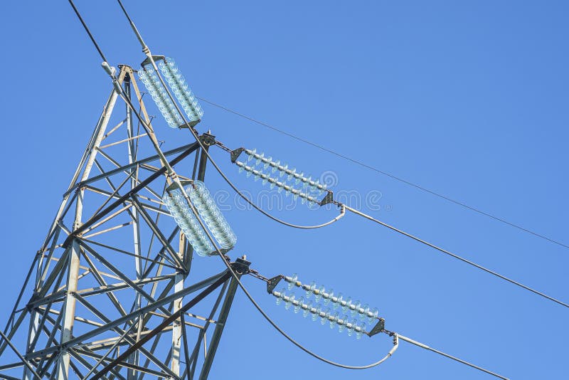Electrical Insulator on a Power Tower on Blue Sky Stock Photo - Image ...