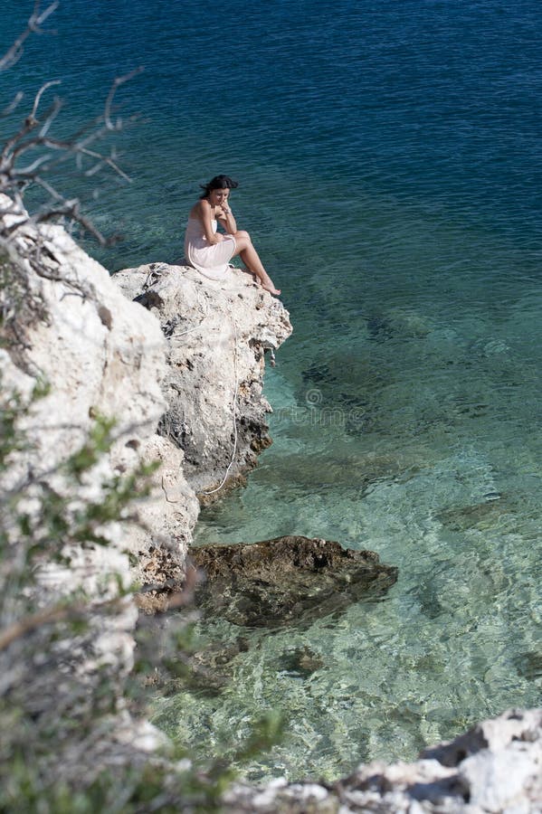 Series of a Women on a Rock Stock Image - Image of travel, ocean: 26896315
