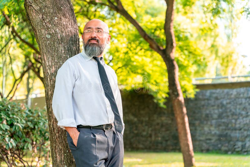 Serious Asian Business Standing in a Park Stock Image - Image of ...