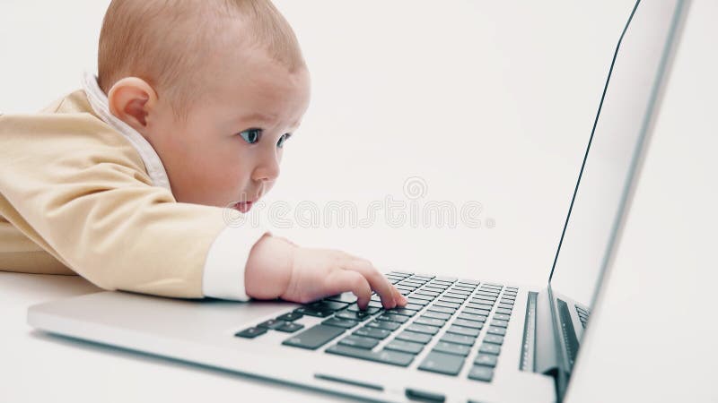 Serious Baby Works on a Laptop Stock Image - Image of modern, play ...