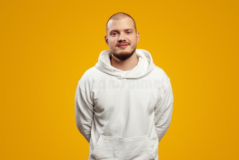 Serious Bearded Hipster Man Looking At Camera Isolated Over Yellow