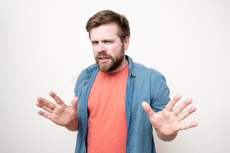 Serious, Bearded Man Stares and Soothes, with a Gesture of Stop Hand ...