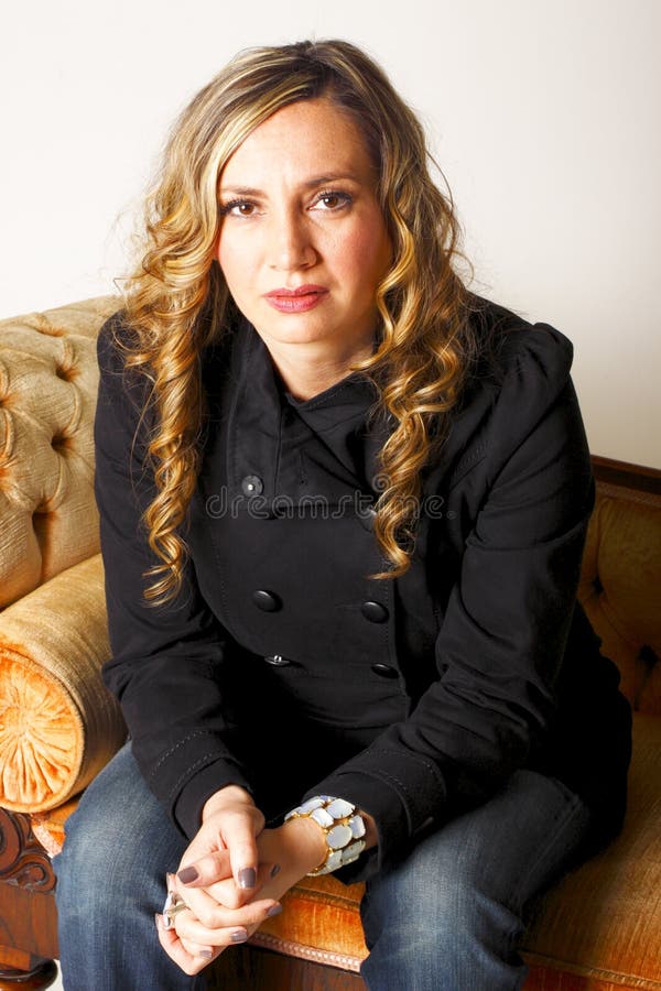 Serious Beautiful Lady Sitting on Couch Stock Image - Image of female ...