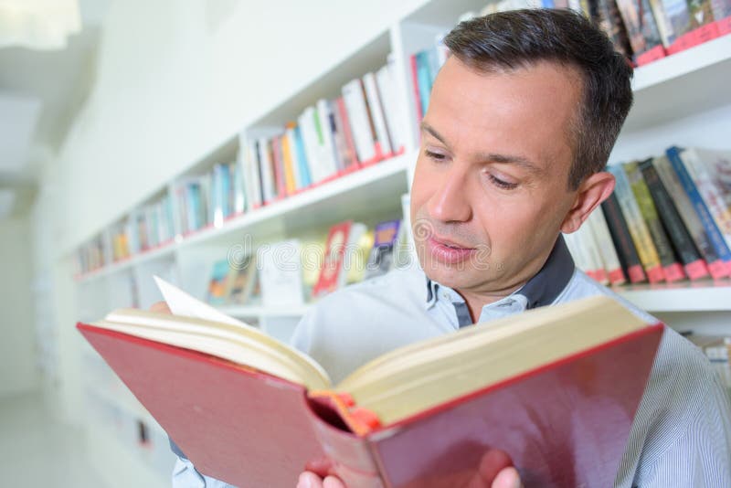 Serious Book Reader in Library Stock Image - Image of read, print ...