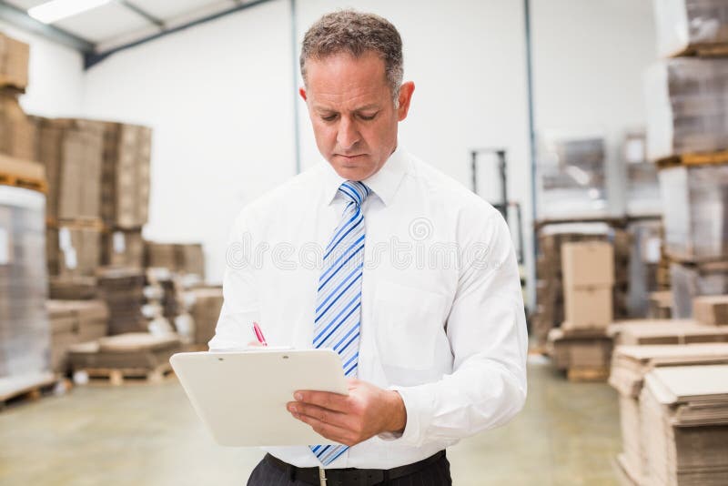 Serious Boss Writing on Clipboard Stock Photo - Image of shipping ...