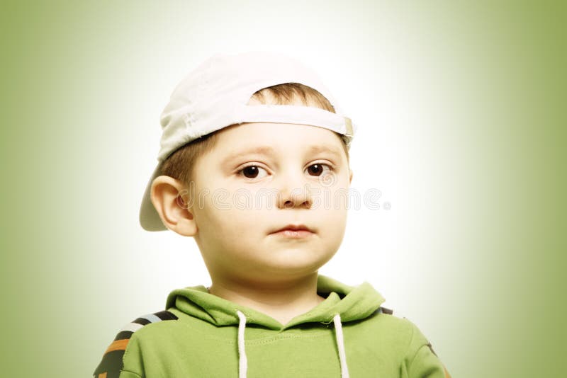 Serious boy in green stock image. Image of male, young - 10427681