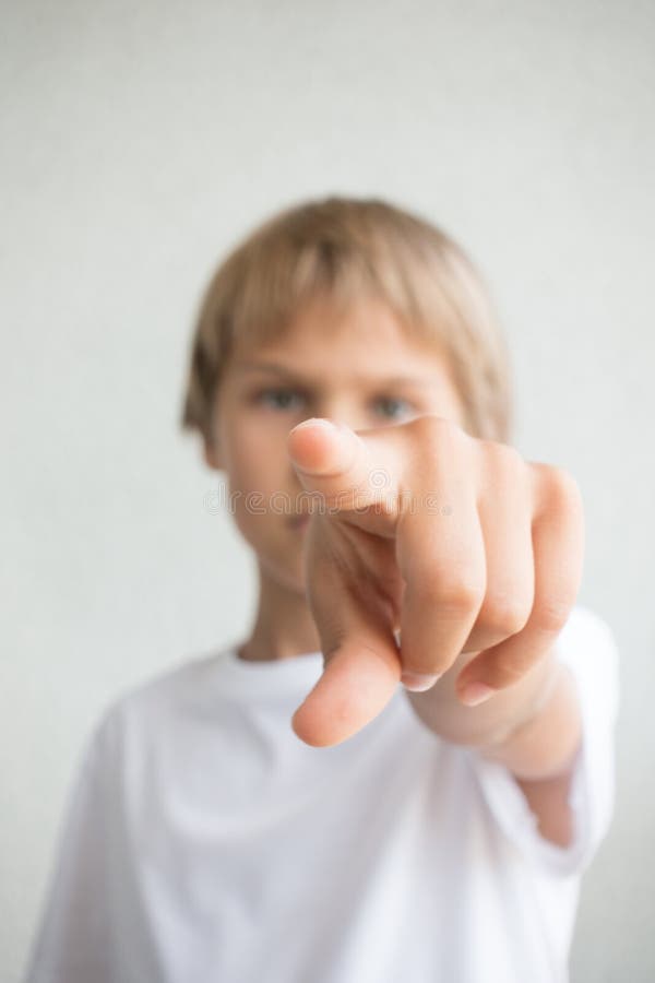 Serious Boy Points Finger at You. Stock Image - Image of school ...