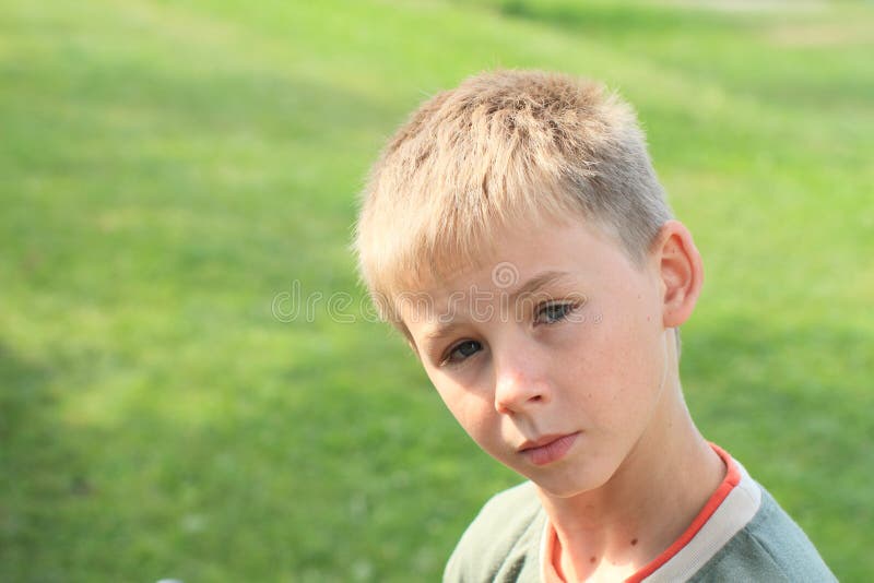 Serious boy stock photo. Image of portrait, face, green - 33109162