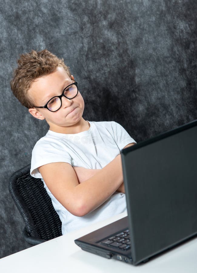 Serious Boy Sitting with Laptop Computer Stock Image - Image of ...
