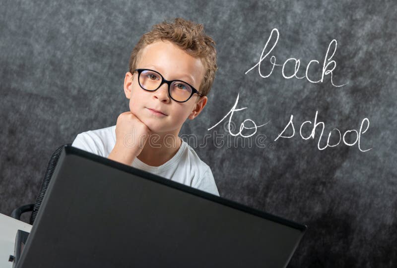 Serious Boy Sitting with Laptop Computer Stock Image - Image of ...