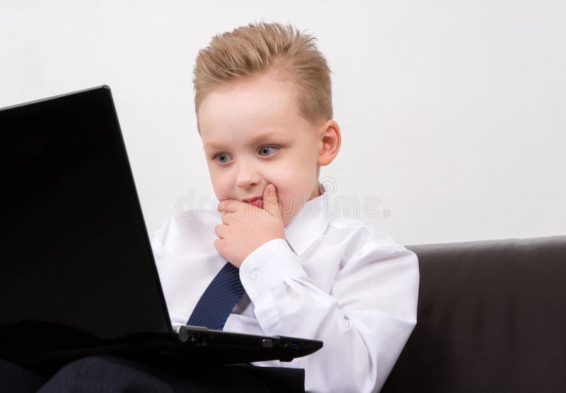 Serious Boy in Suit Looking at the Computer Stock Photo - Image of ...