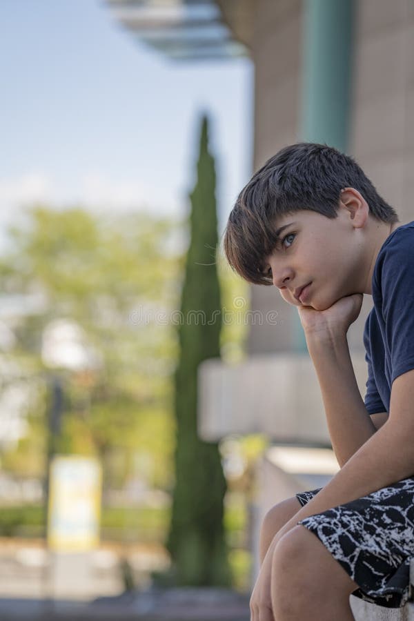 Serious Boy Thinking Over a Problem and Contemplating Sitting on a ...