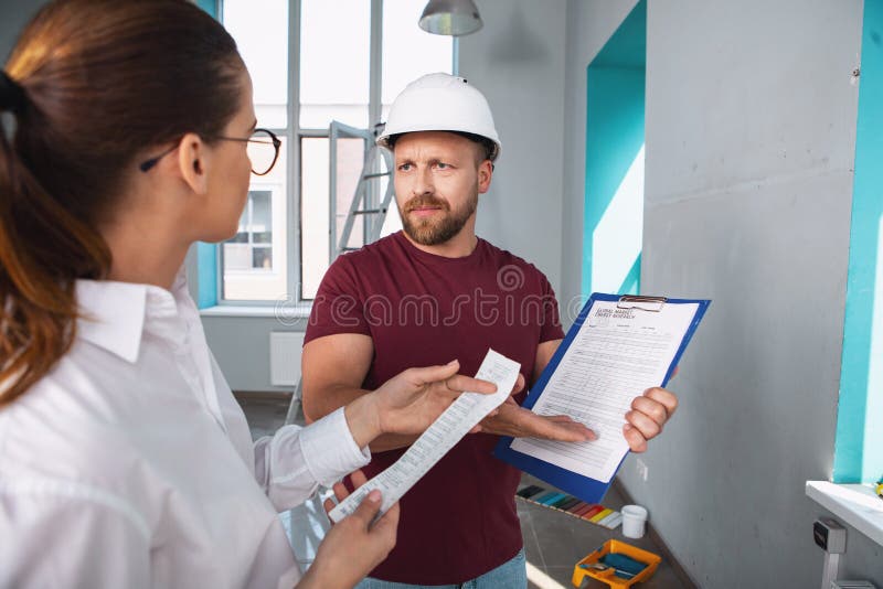 Serious Builder Showing the Contract To His Client Stock Photo - Image ...