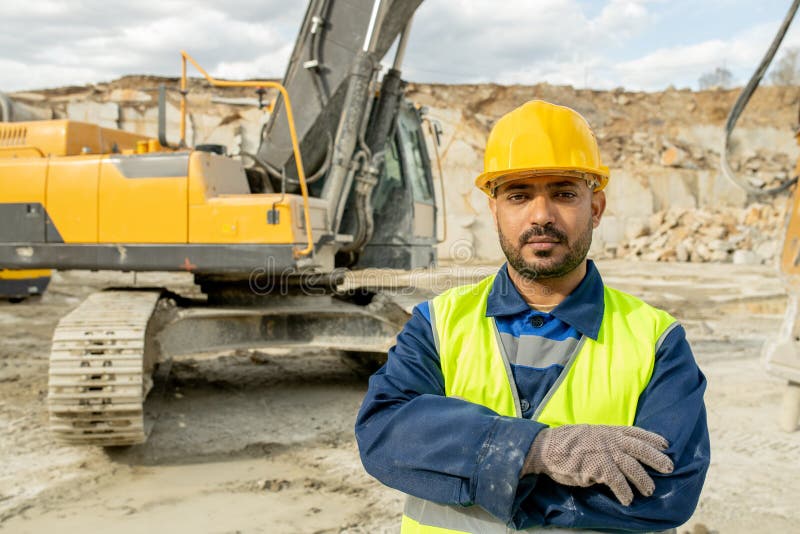 Serious Builder in Workwear Crossing Arms on Chest Stock Photo - Image ...