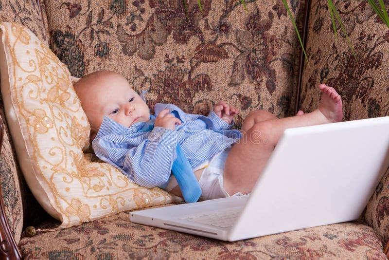 Serious Business Baby Near Computer on Sofa Stock Image - Image of ...