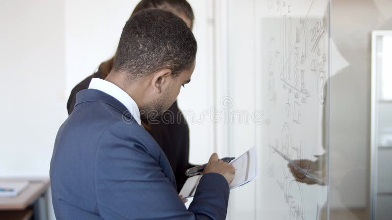 Serious Business Colleagues Analyzing Paper Report Stock Video - Video ...