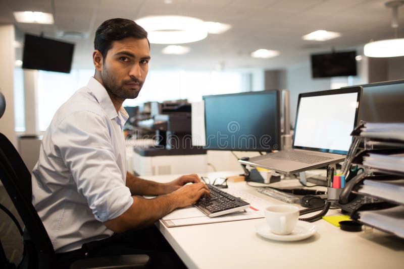 Serious Business Executive Working at Office Desk Stock Image - Image ...
